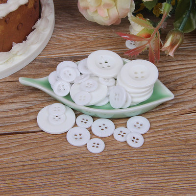 Custom Manfactur Low MOQ 14L Lettering White Ivory Resin Jeans Shirt Round Button For Clothes Resin Button 4 holes